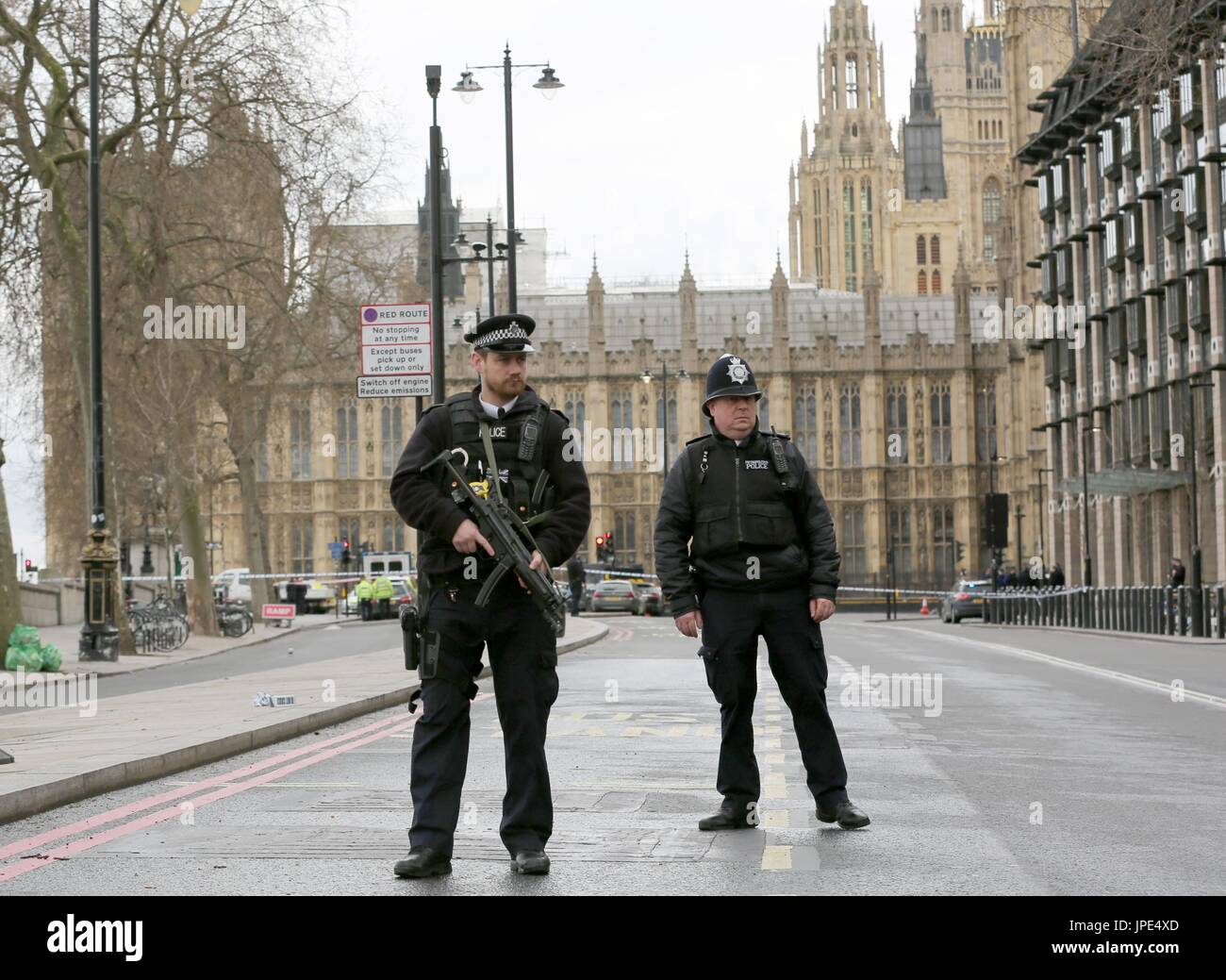 Police officers stand guard in front of the Houses of Parliament in ...