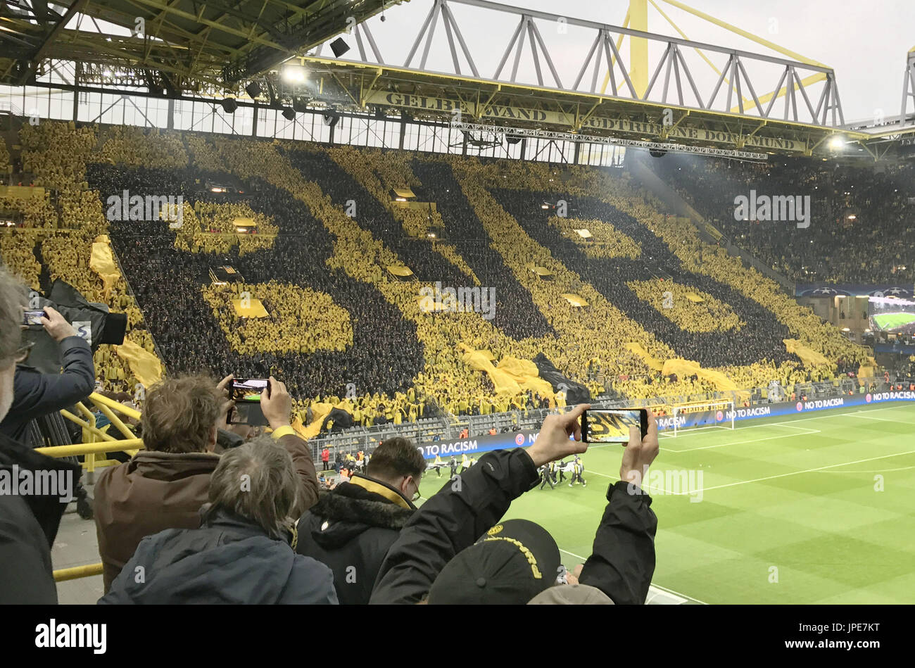 Fans form the letters "BVB," the shortened name of Borussia Dortmund ...