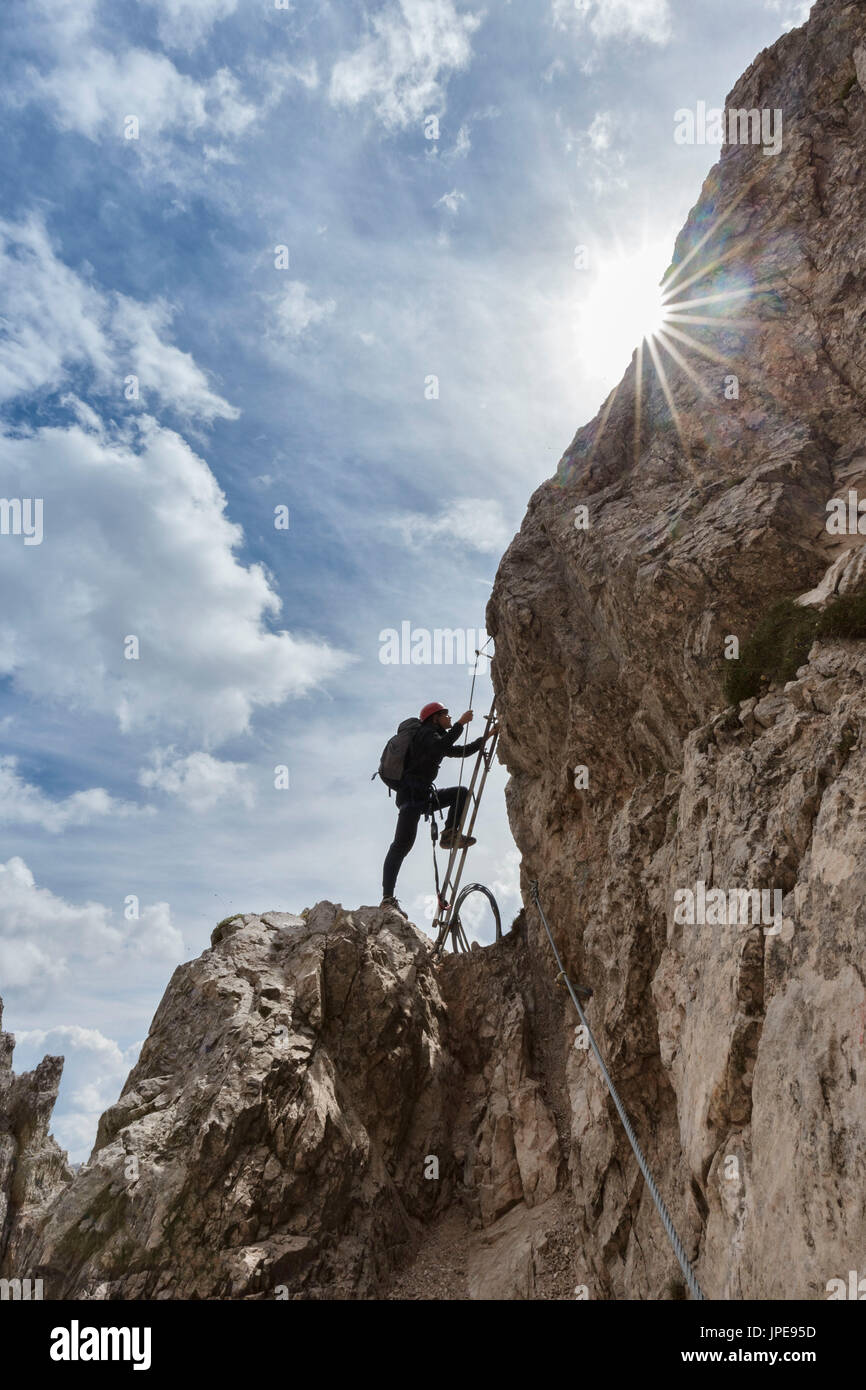 Europe, Italy, Veneto, Belluno, Sexten Dolomites. a hiker along the via ...