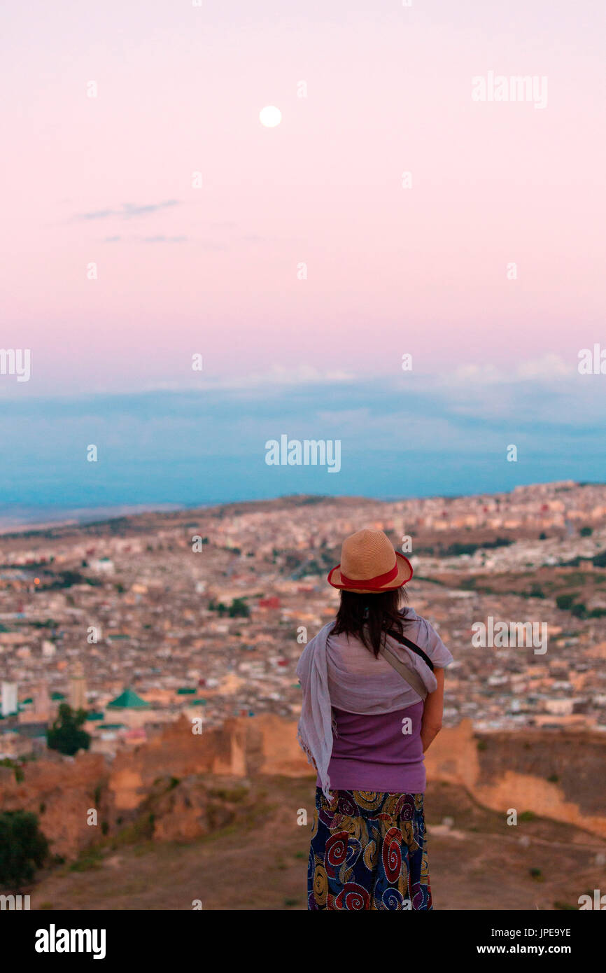 North Africa,Morocco,Fes district, Medina of Fes. Girl looking at city ...