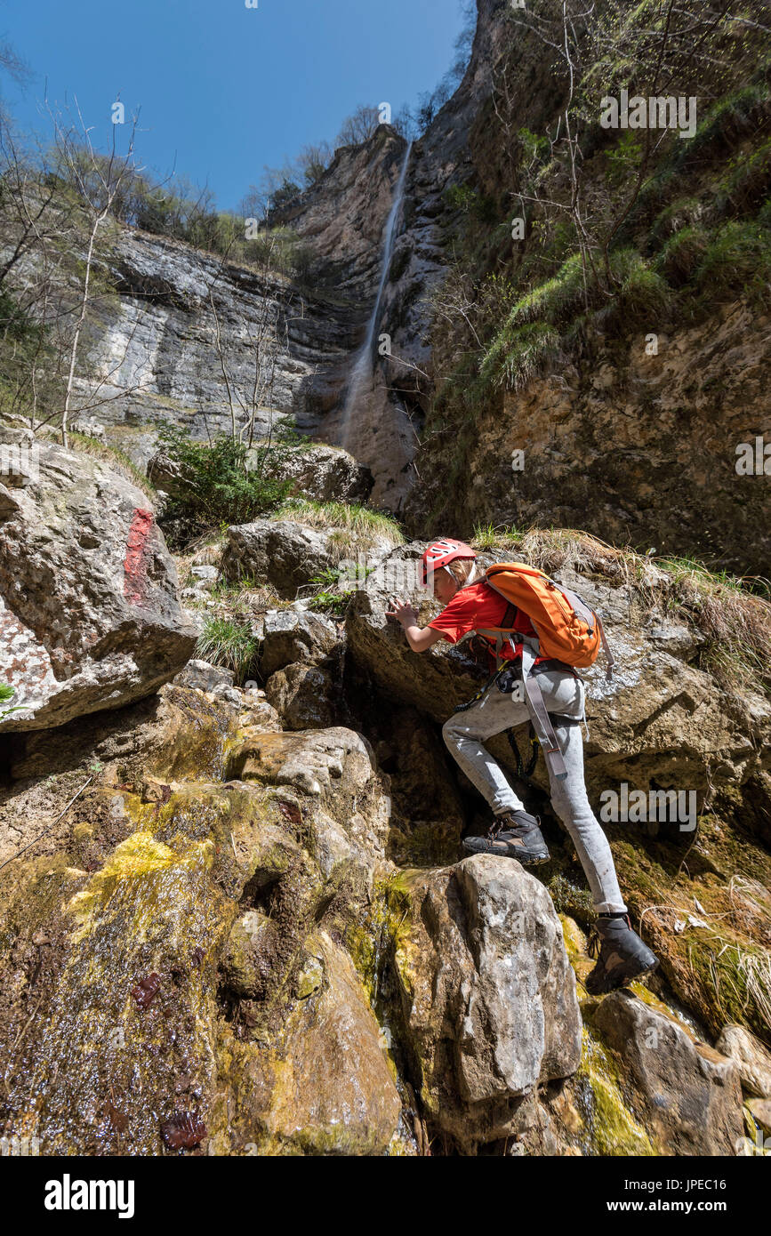 Ferrata Burrone, Mezzocorona, Trentino, Italy. Mountaineer in the gorge ...