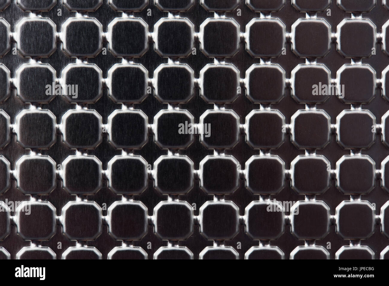 Square tiles design on metal shiny background. Close-up of metallic ...