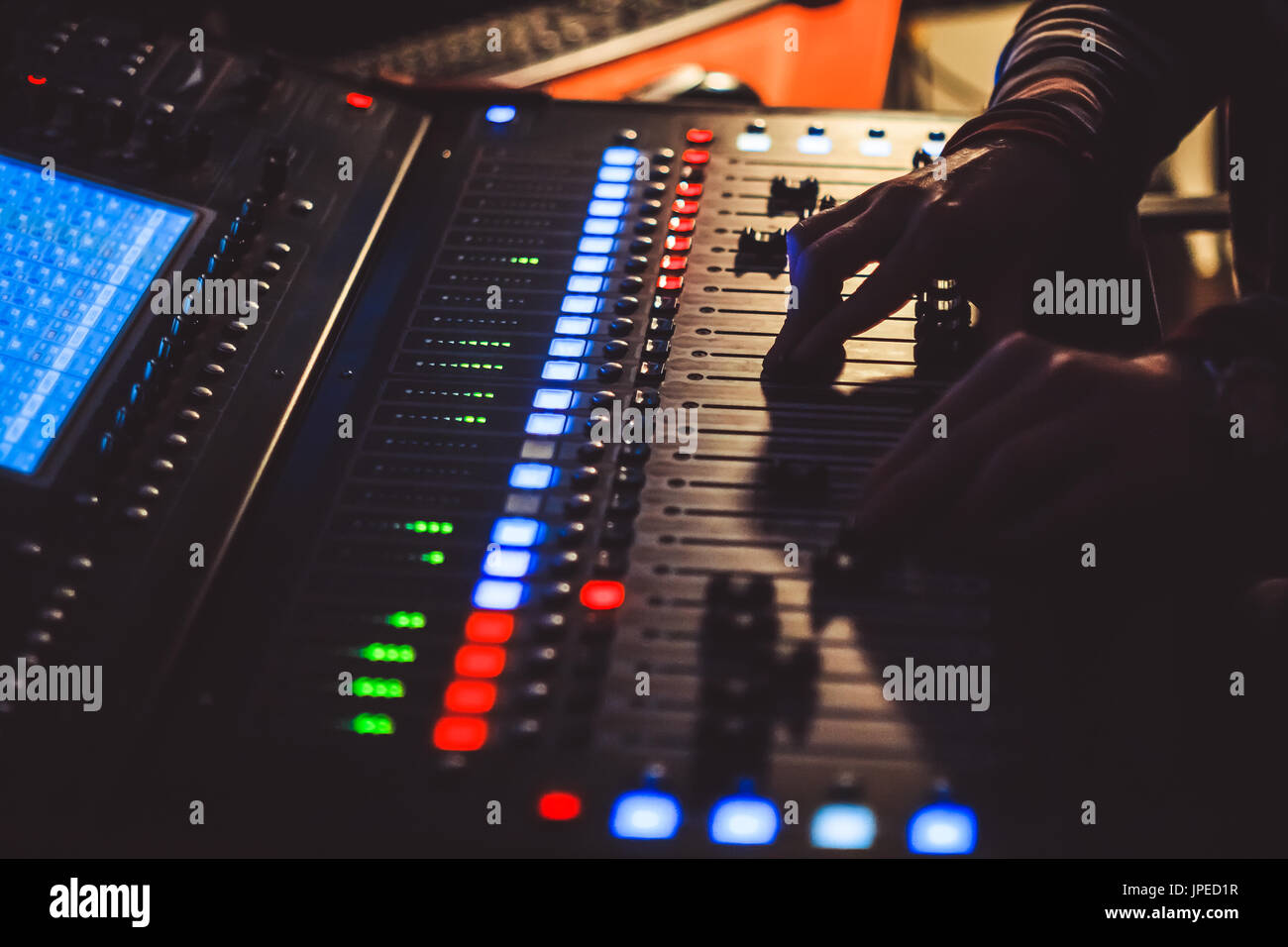 The hands of the sound engineer on the mixing console Stock Photo - Alamy