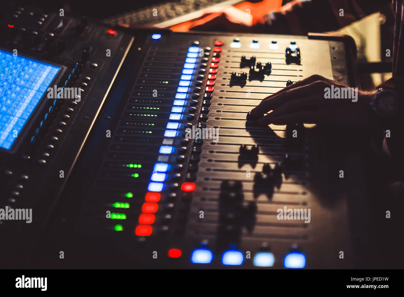 The hands of the sound engineer on the mixing console Stock Photo - Alamy