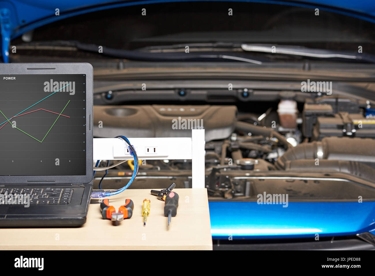 Computer auto diagnostic closeup of working place table. Tools for ...