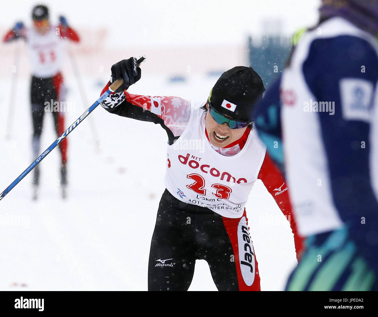 Japanese cross-country skier Yuki Kobayashi crosses the finish line to ...