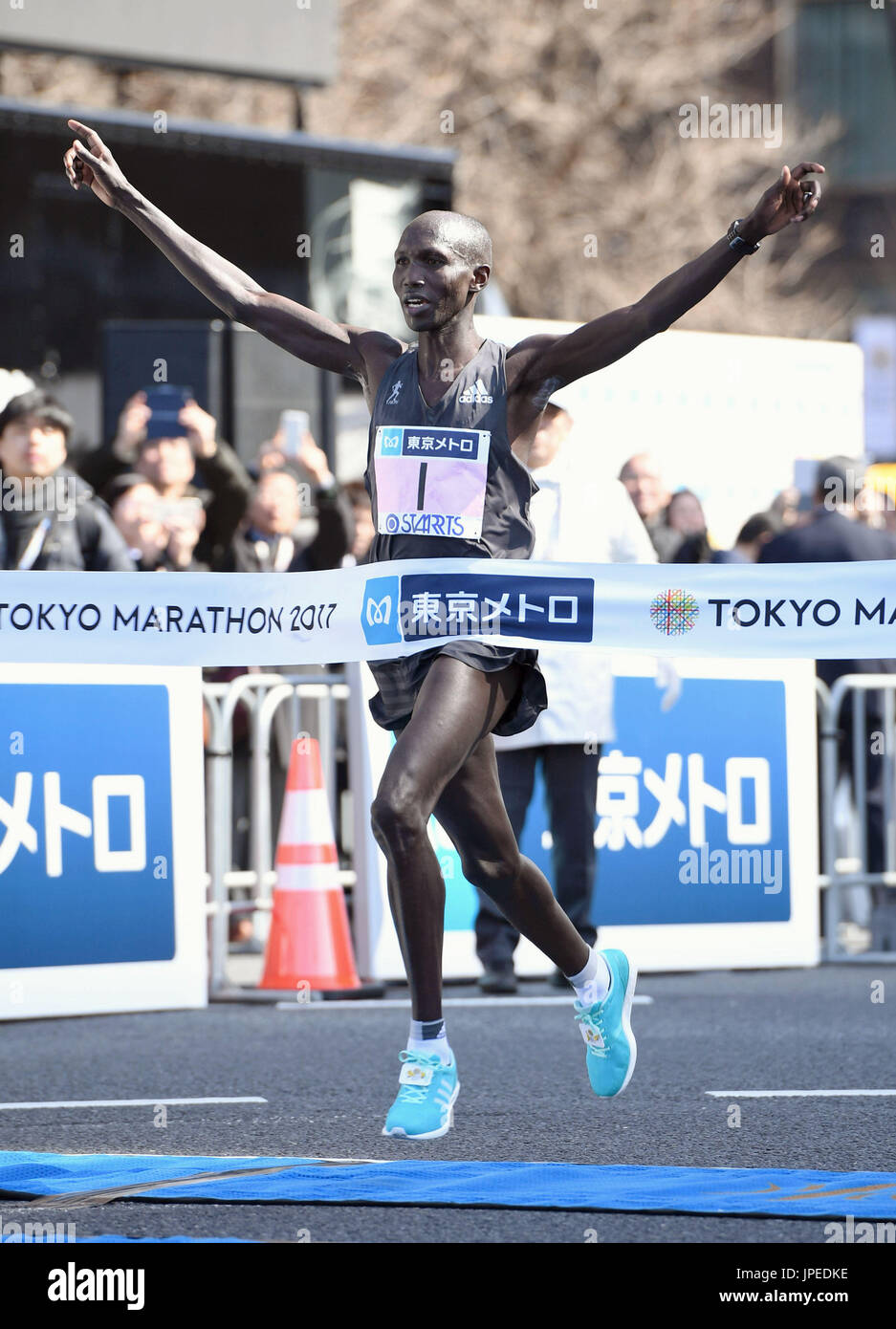 Former world record holder Wilson Kipsang of Kenya crosses the finish ...