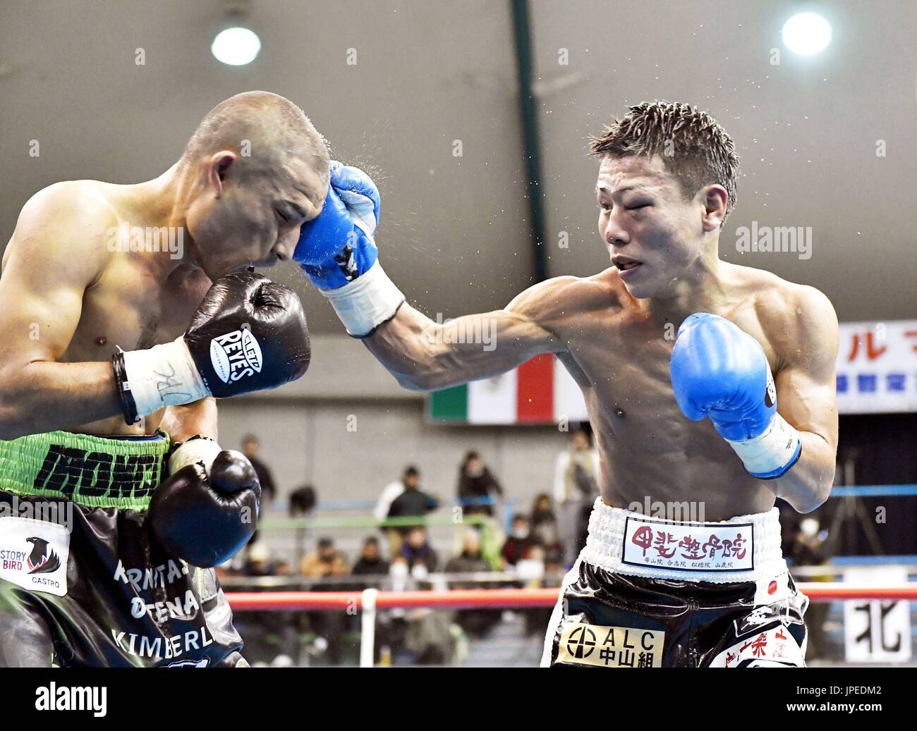 Japan's Tatsuya Fukuhara (R) lands a punch to the temple of Mexican ...