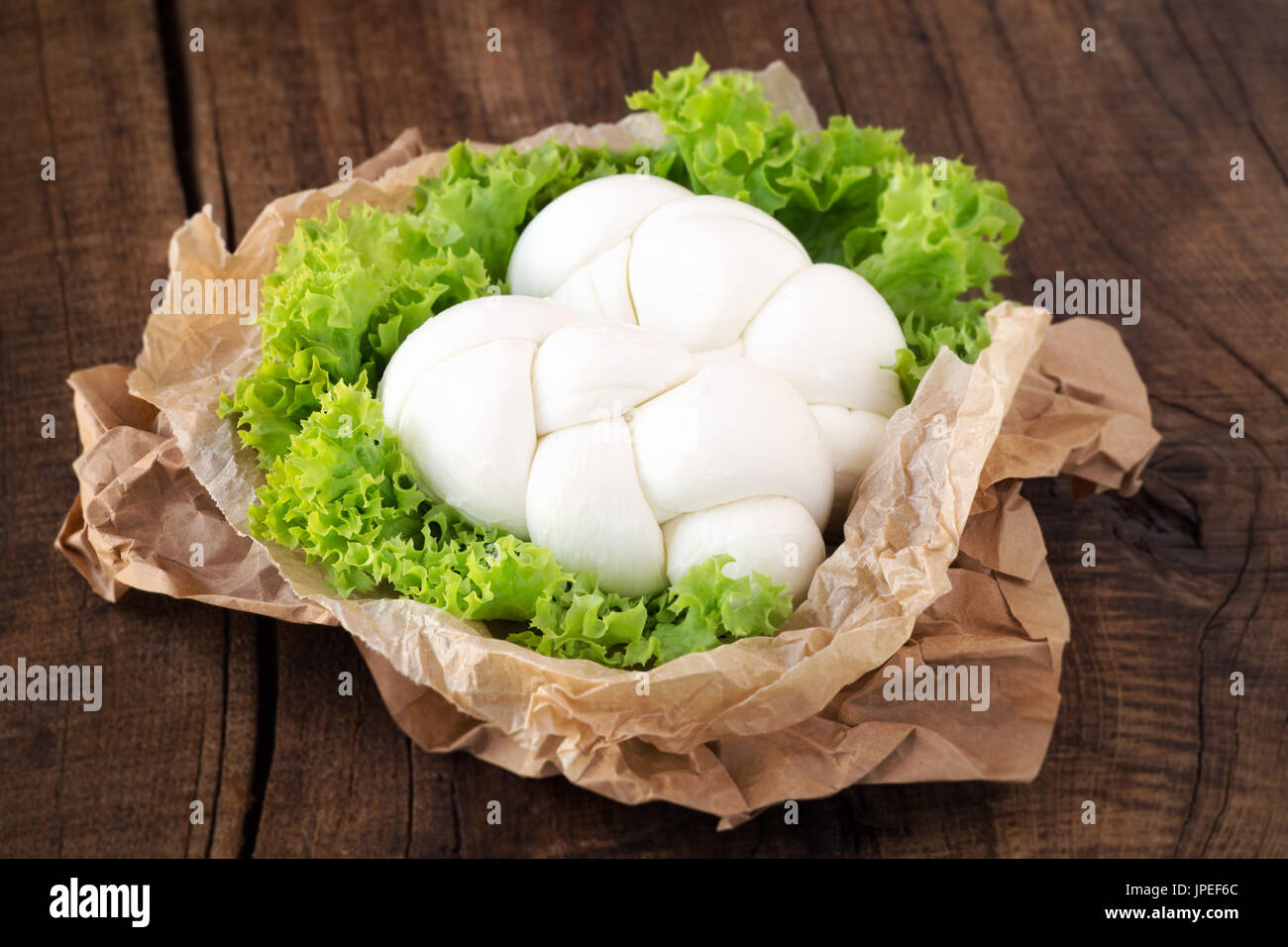 Braided mozzarella cheese with lettuce - Treccia di mozzarella Stock ...
