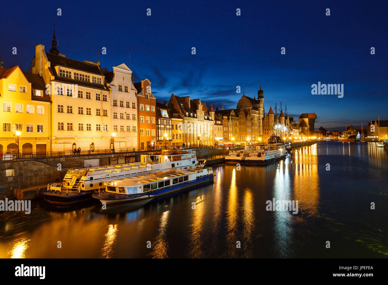 Buildings of the old town Gdansk reflected in a water in evening Stock ...