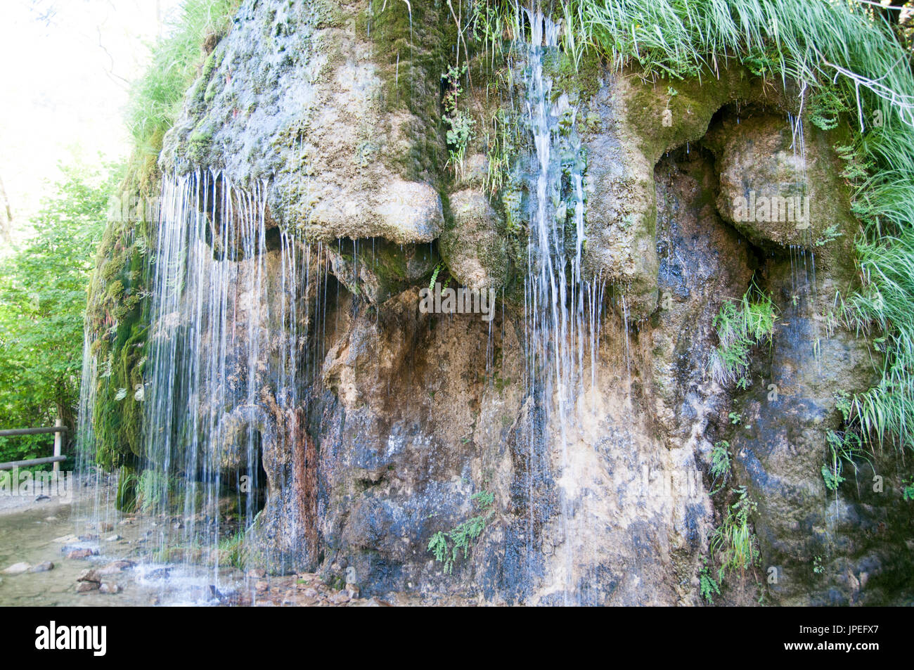 Delicate waterfall of fresh spring water near the Ermita de Sta Elena ...