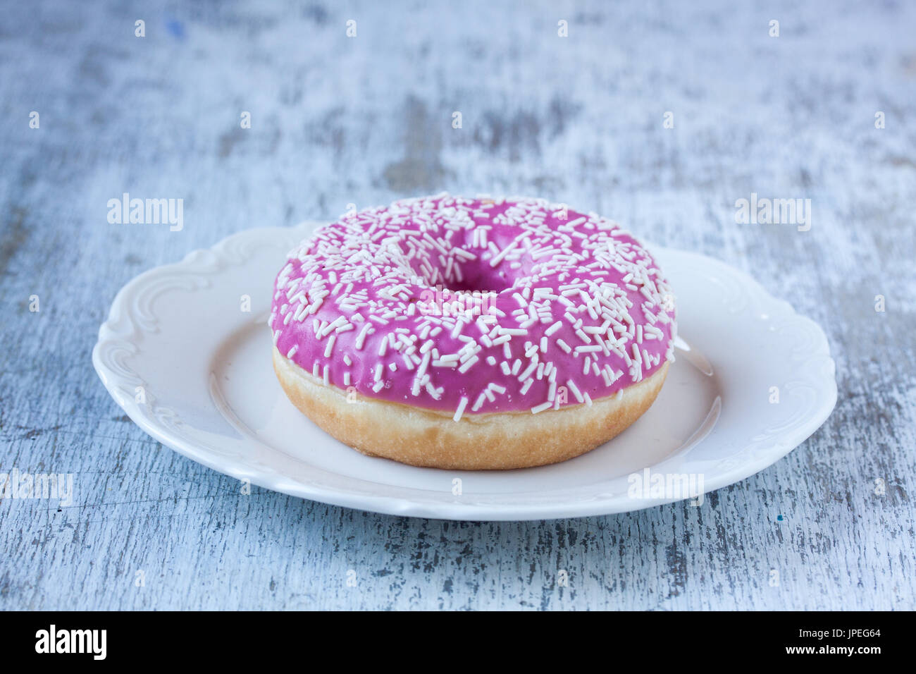 Still life pink donut hi-res stock photography and images - Alamy