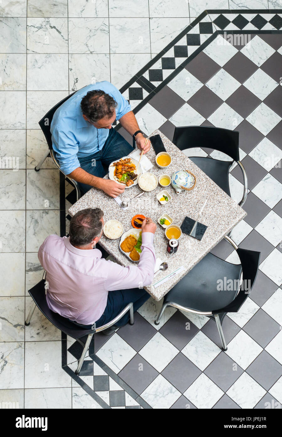 Two men eating restaurant hi-res stock photography and images - Alamy