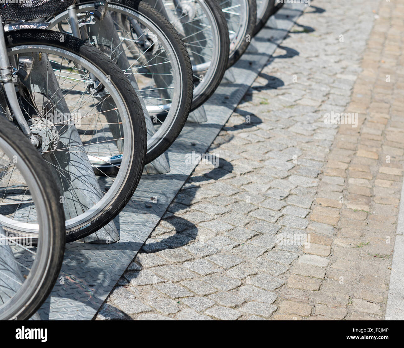 close up on bike wheels in row Stock Photo - Alamy