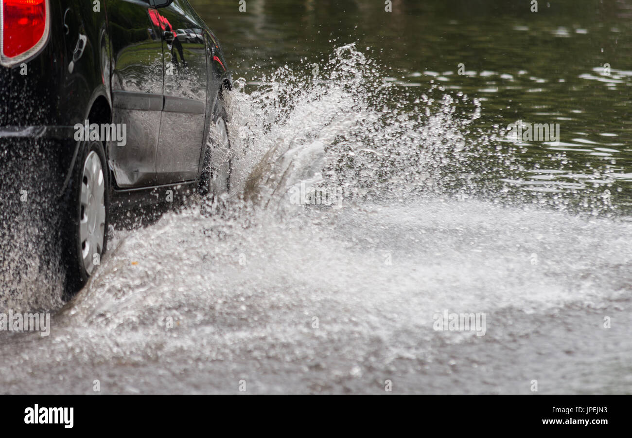 Car tire splashing in water hi-res stock photography and images - Alamy
