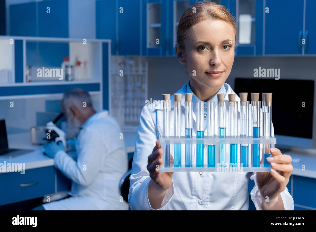 Lab technician looking into camera hi-res stock photography and images ...
