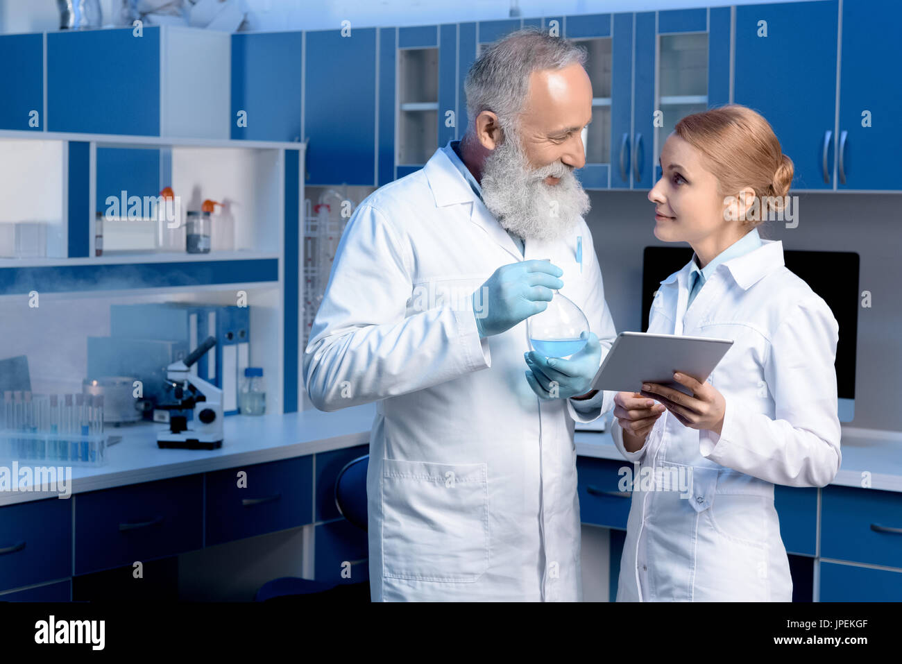 Two scientists talk in laboratory hi-res stock photography and images ...