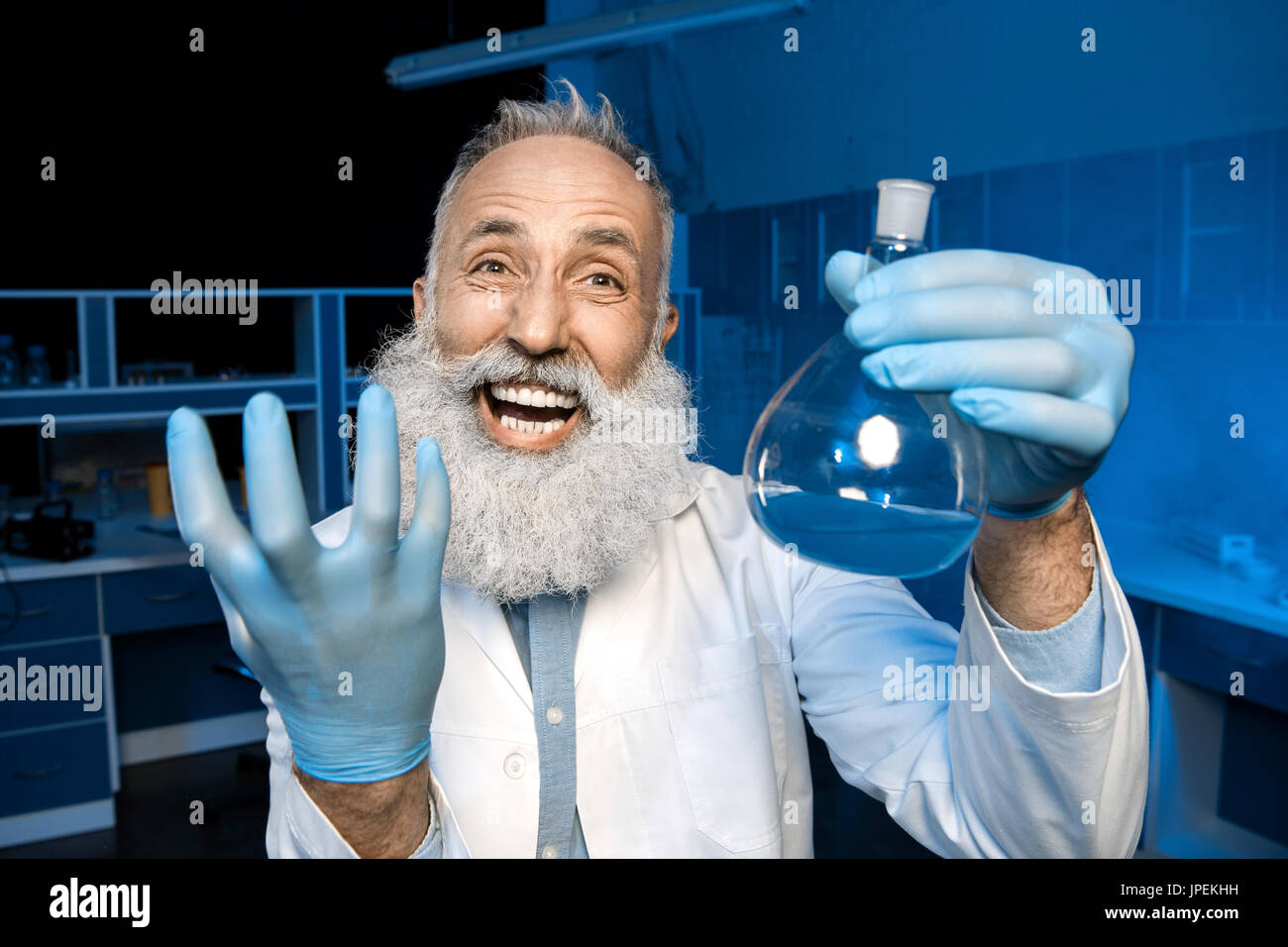 happy grey haired scientist celebrating success of scientific ...