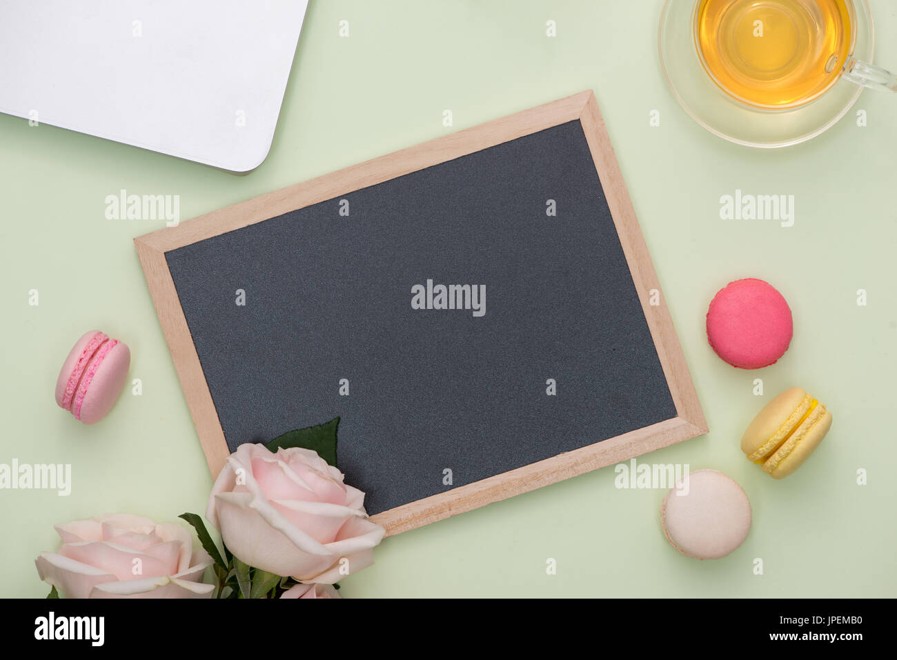 Flatlay of sweet macaroons and blank board Stock Photo - Alamy