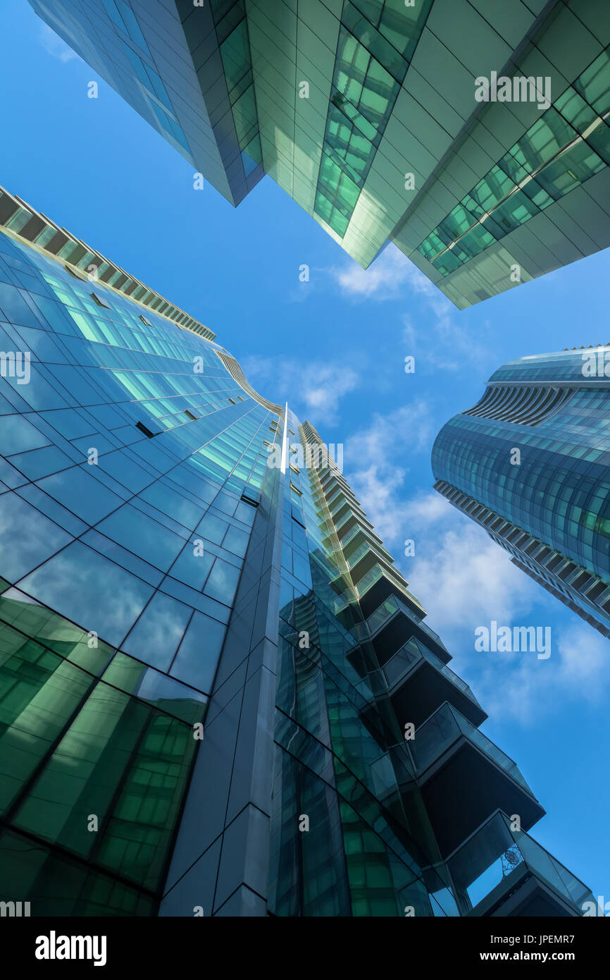 The architectural structures of the buildings with green glass windows ...