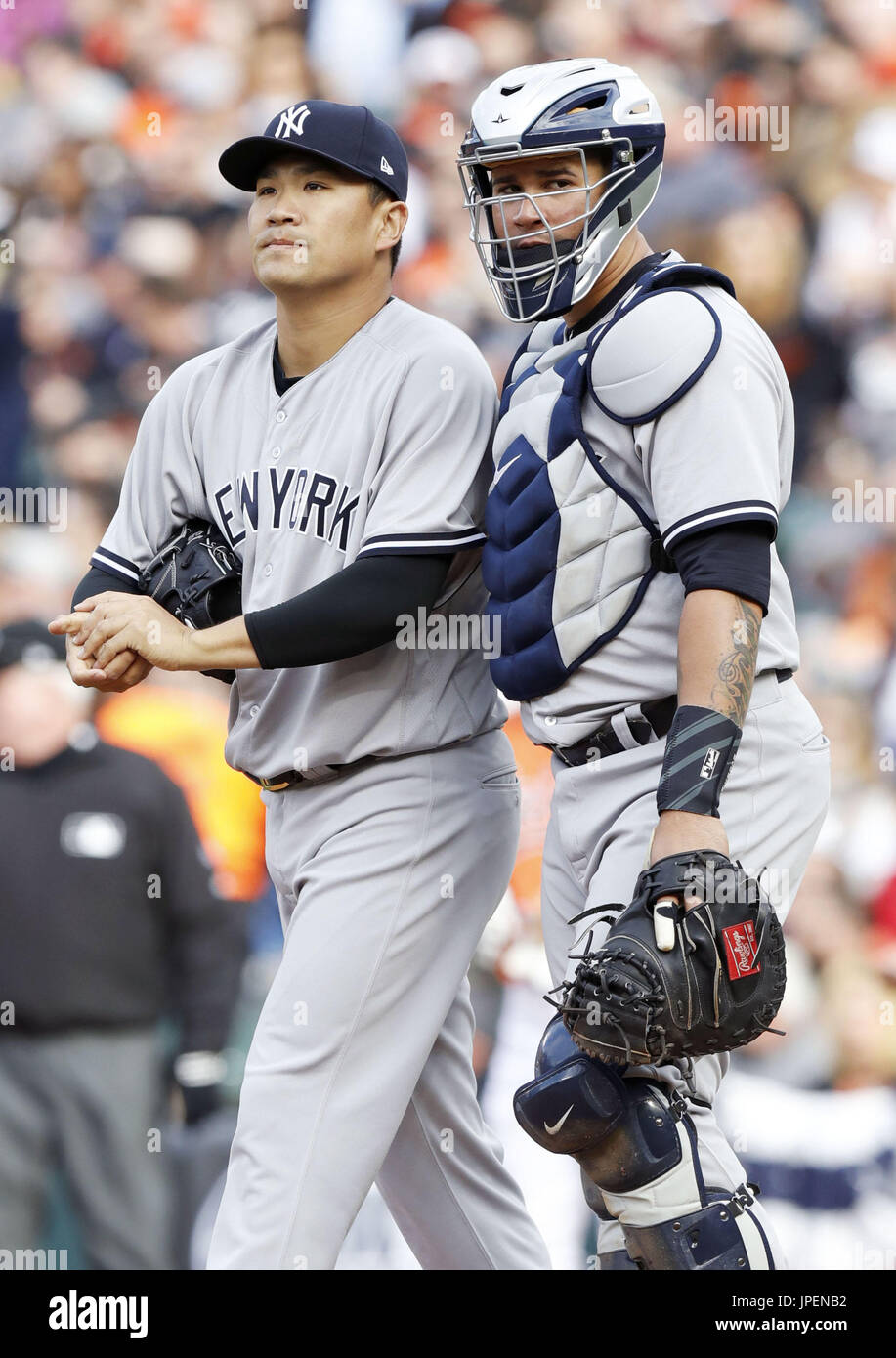 New York Yankees pitcher Masahiro Tanaka and catcher Gary Sanchez talk during the fourth inning ...