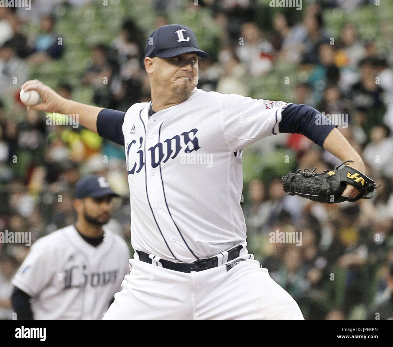 Brian Wolfe of the Seibu Lions pitches against the Lotte Marines at ...