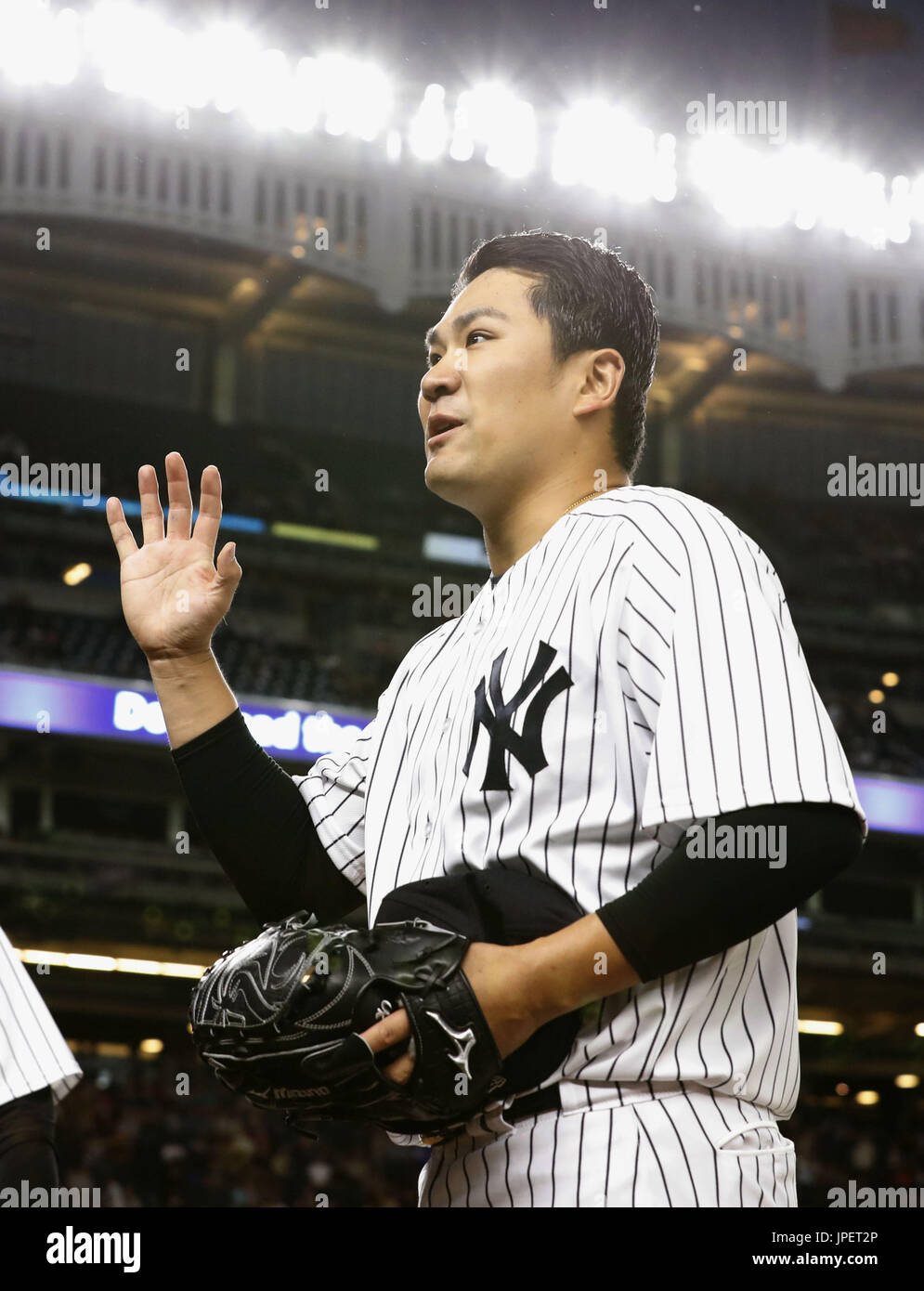 New York Yankees pitcher Masahiro Tanaka heads to the dugout after ending the fourth inning ...