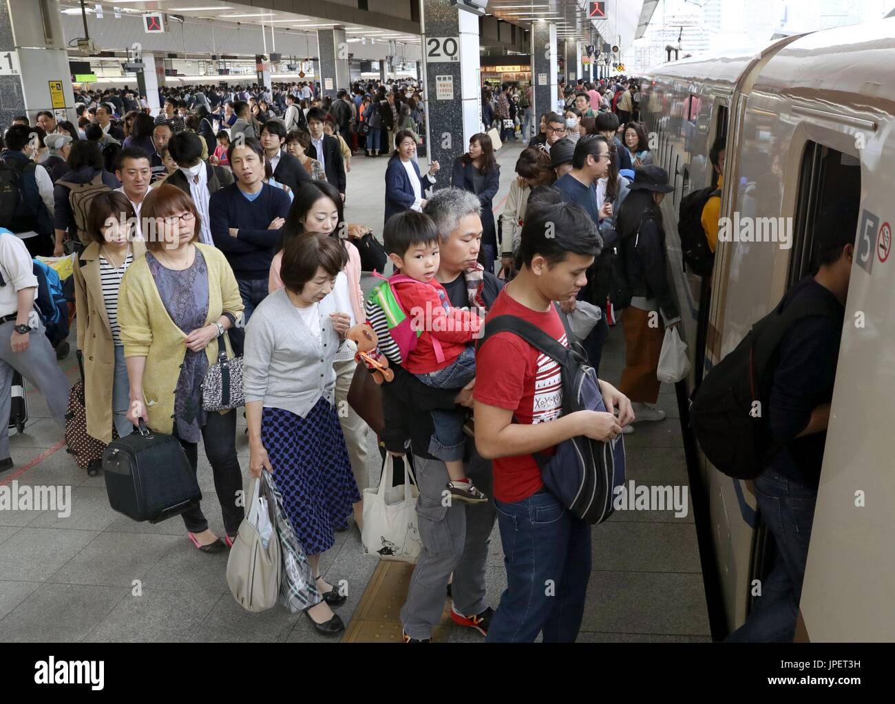 Japan's Golden Week holiday travelers crowd a shinkansen bullet train ...