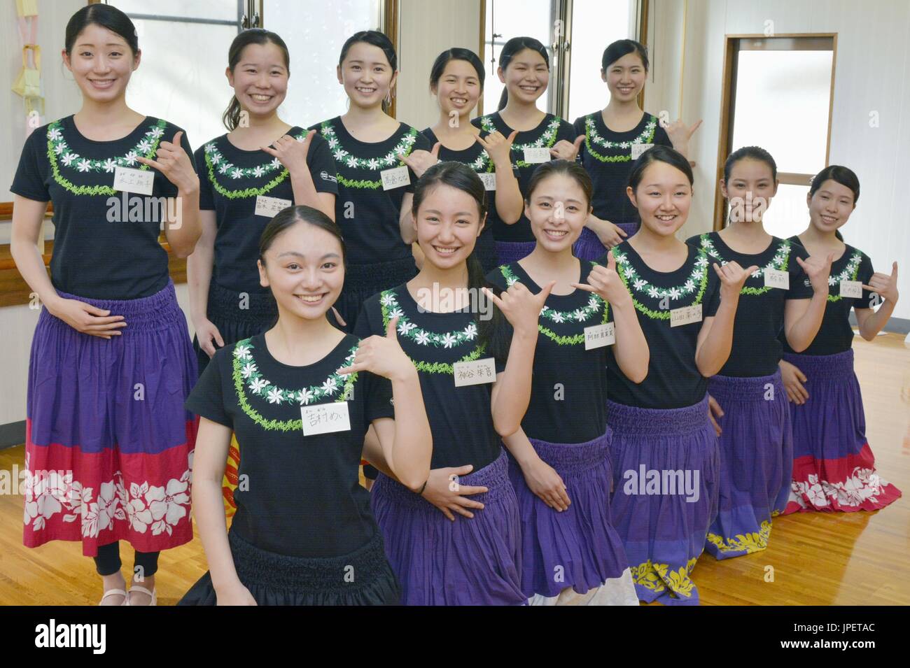 New hula dancers pose for photos after their first practice session on ...