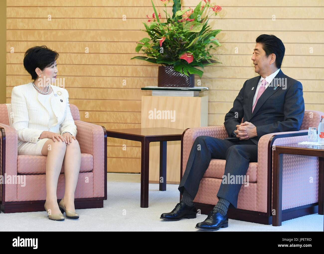 Tokyo Gov. Yuriko Koike (L) and Japanese Prime Minister Shinzo Abe hold ...