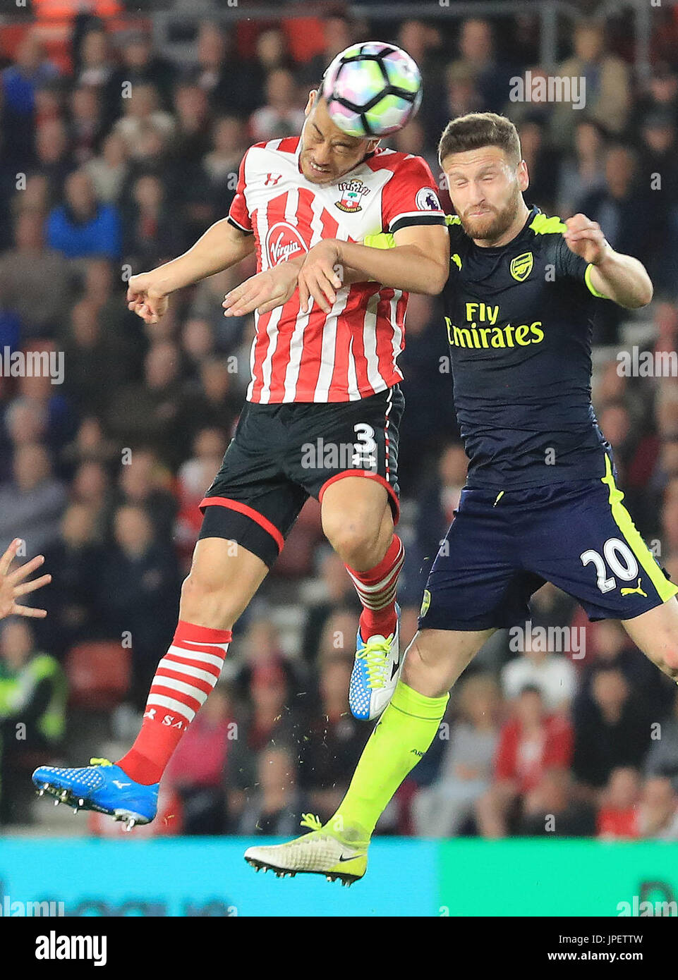 Southampton's Maya Yoshida (L) and Shkodran Mustafi of Arsenal vie for ...