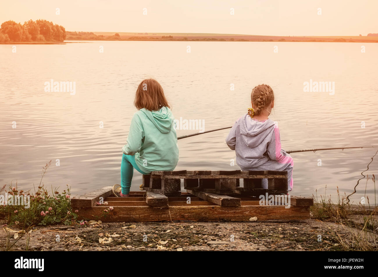 Two girls fishing hi-res stock photography and images - Alamy