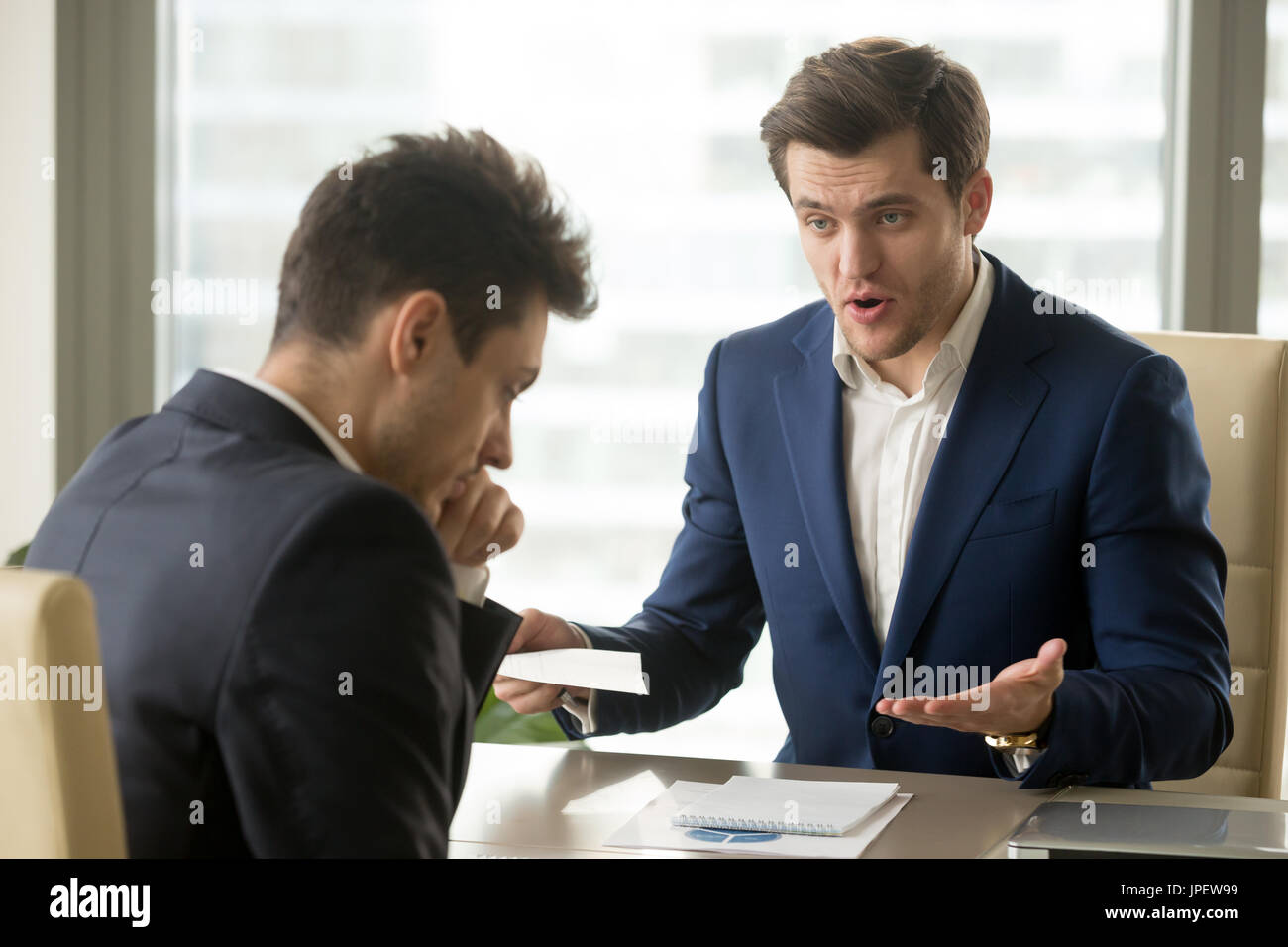 Boss yelling at employee for missing deadline, bad work results Stock ...