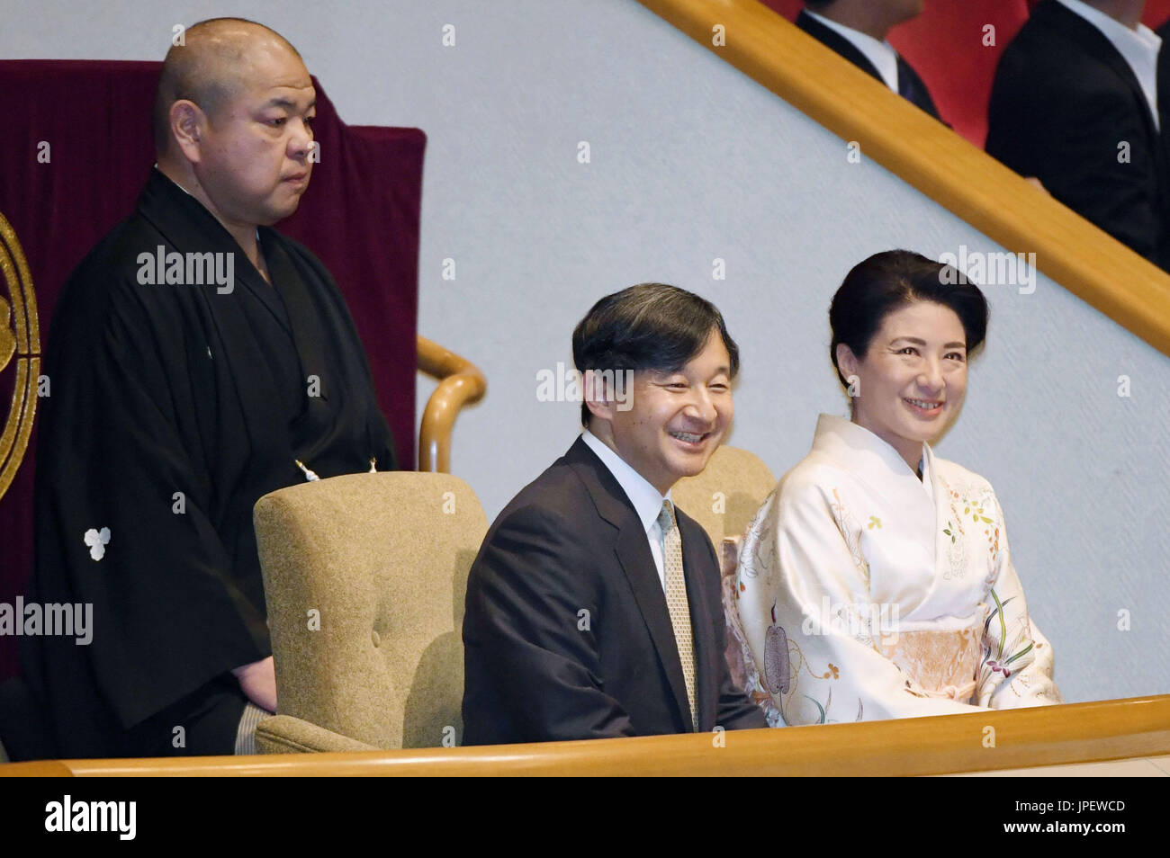 Japan's Crown Prince Naruhito (C) and Crown Princess Masako (R) watch ...