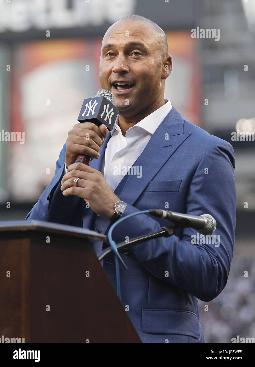 Former New York Yankees shortstop Derek Jeter speaks during a pregame ceremony to retire his No ...