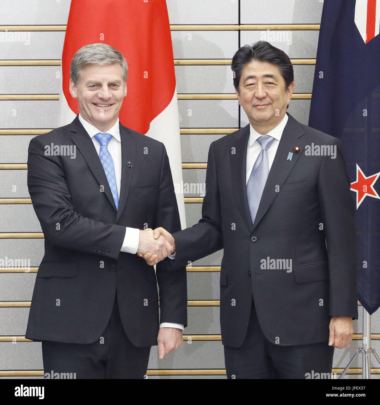 Japanese Prime Minister Shinzo Abe (R) and his New Zealand counterpart ...
