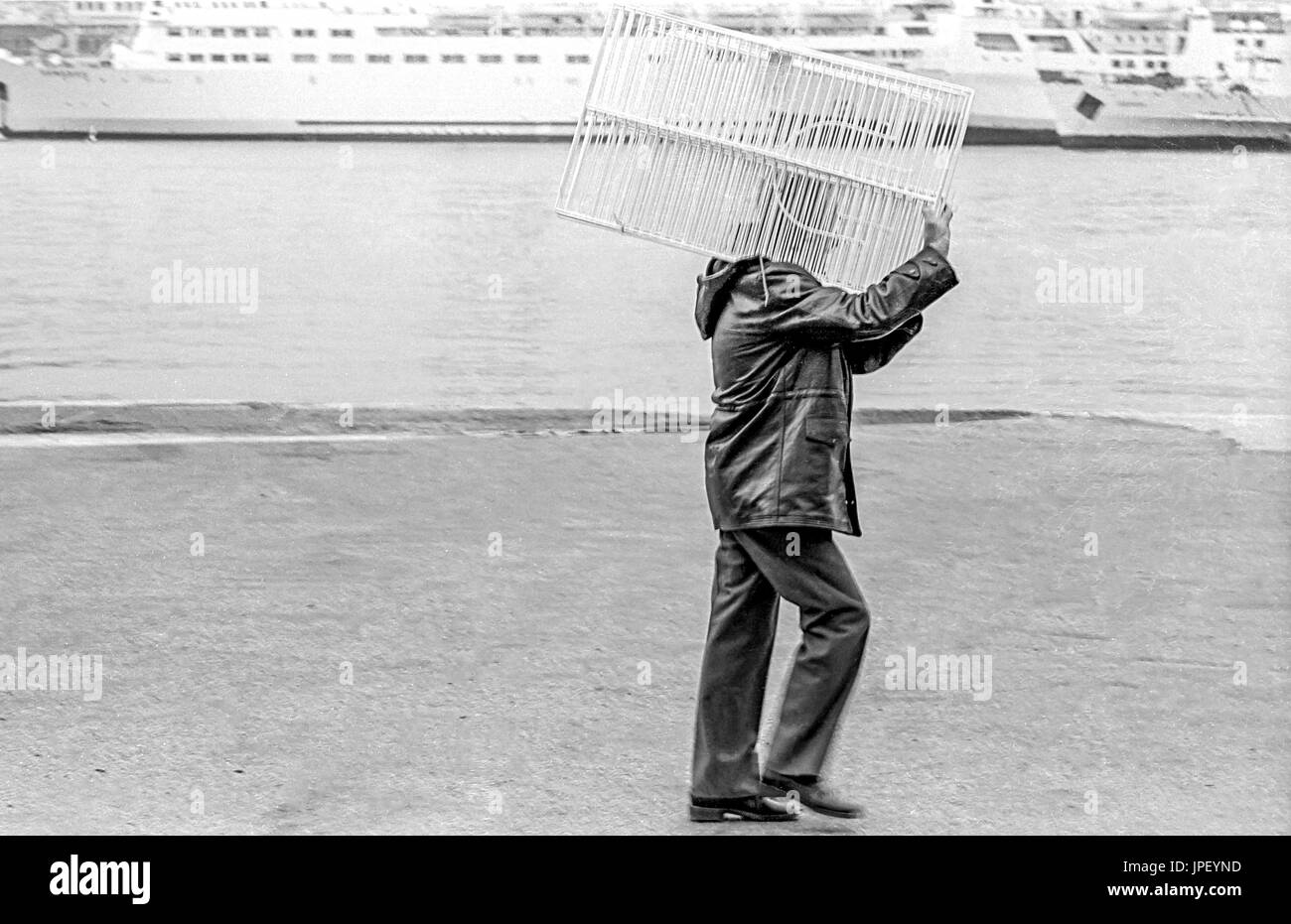 Man carrying bird cage hi-res stock photography and images - Alamy