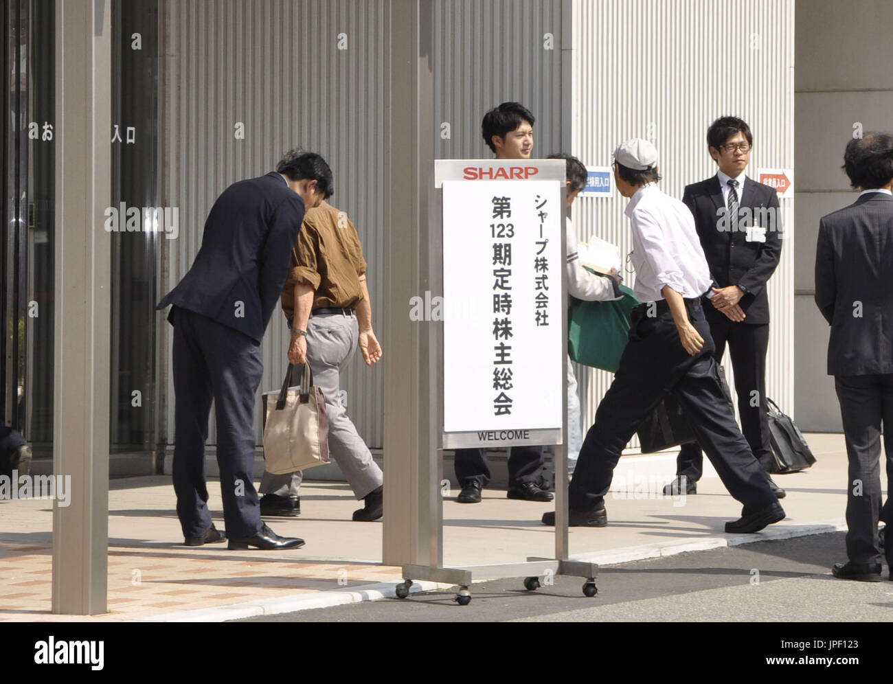 Sharp Corp. shareholders enter the company's headquarters in Sakai ...