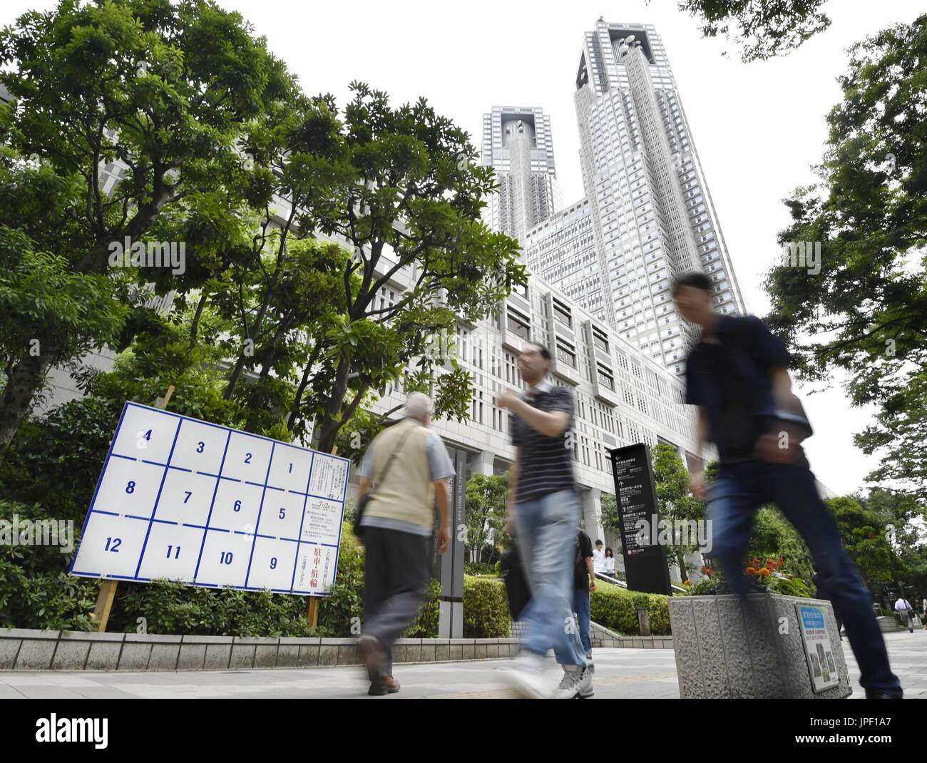 A board (L) is installed outside the Tokyo metropolitan government hall ...