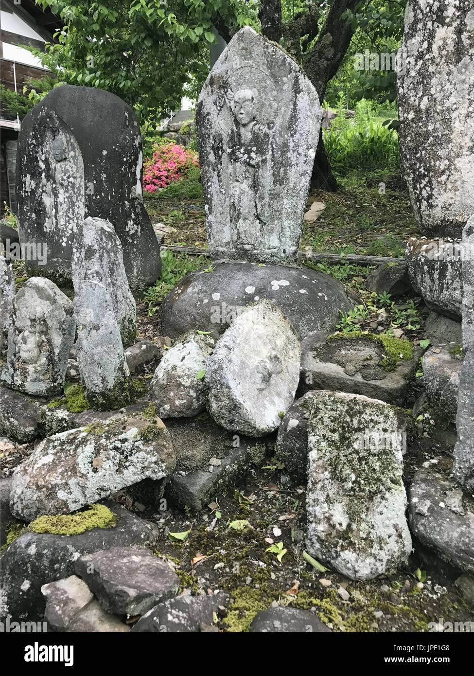 Stone Buddha statues are overturned following a magnitude 5.6 ...