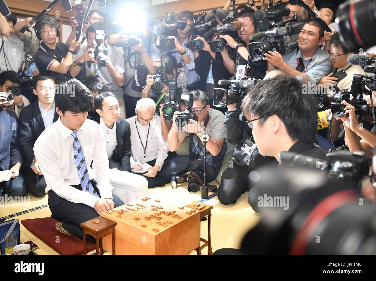 Japan's youngest professional shogi player, 14-year-old Sota Fujii (L ...