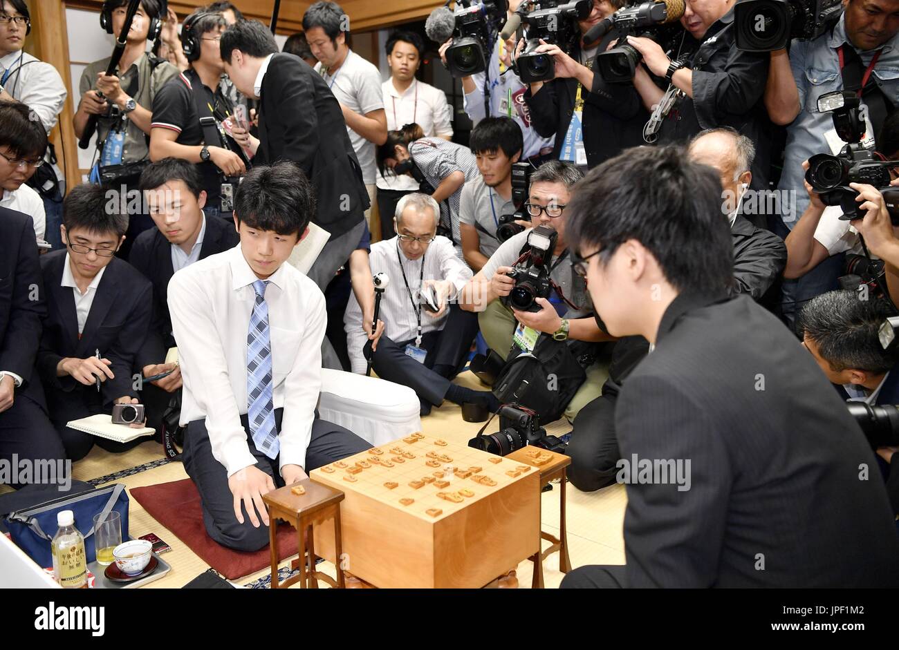 Japan's youngest professional shogi player, 14-year-old Sota Fujii (L ...