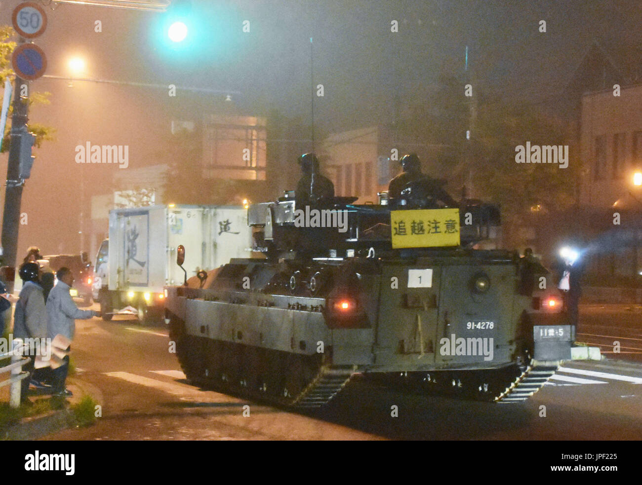 A combat vehicle of the Ground Self-Defense Force travels on a public ...