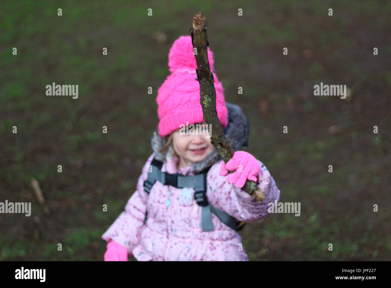 Child playing with stick Stock Photo - Alamy