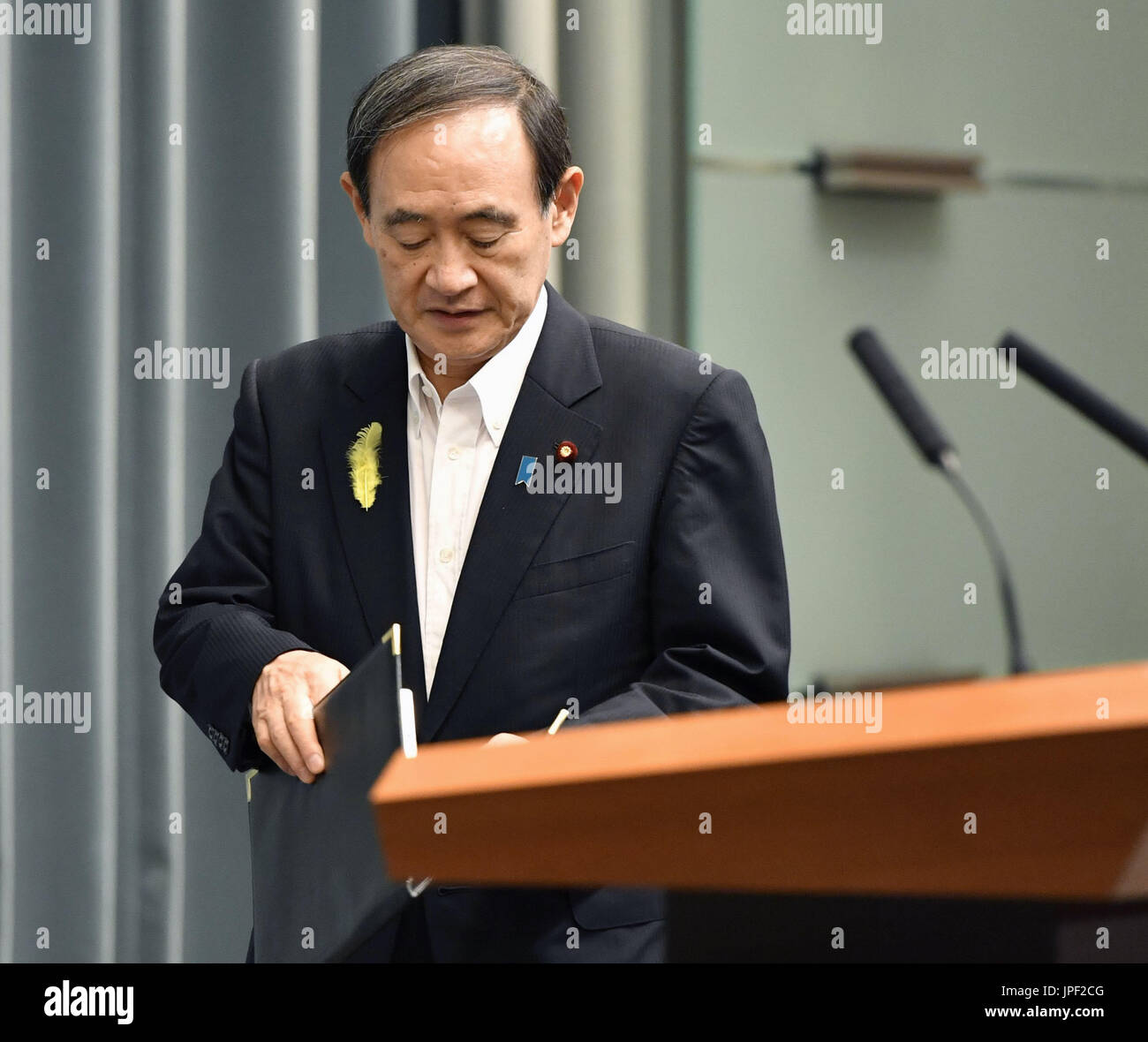 Chief Cabinet Secretary Yoshihide Suga attends a press conference in ...