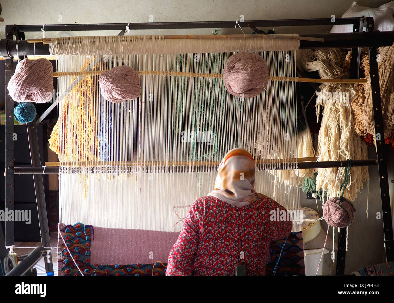 Woman Weaving On Loom To Make Carpet High Resolution Stock Photography ...