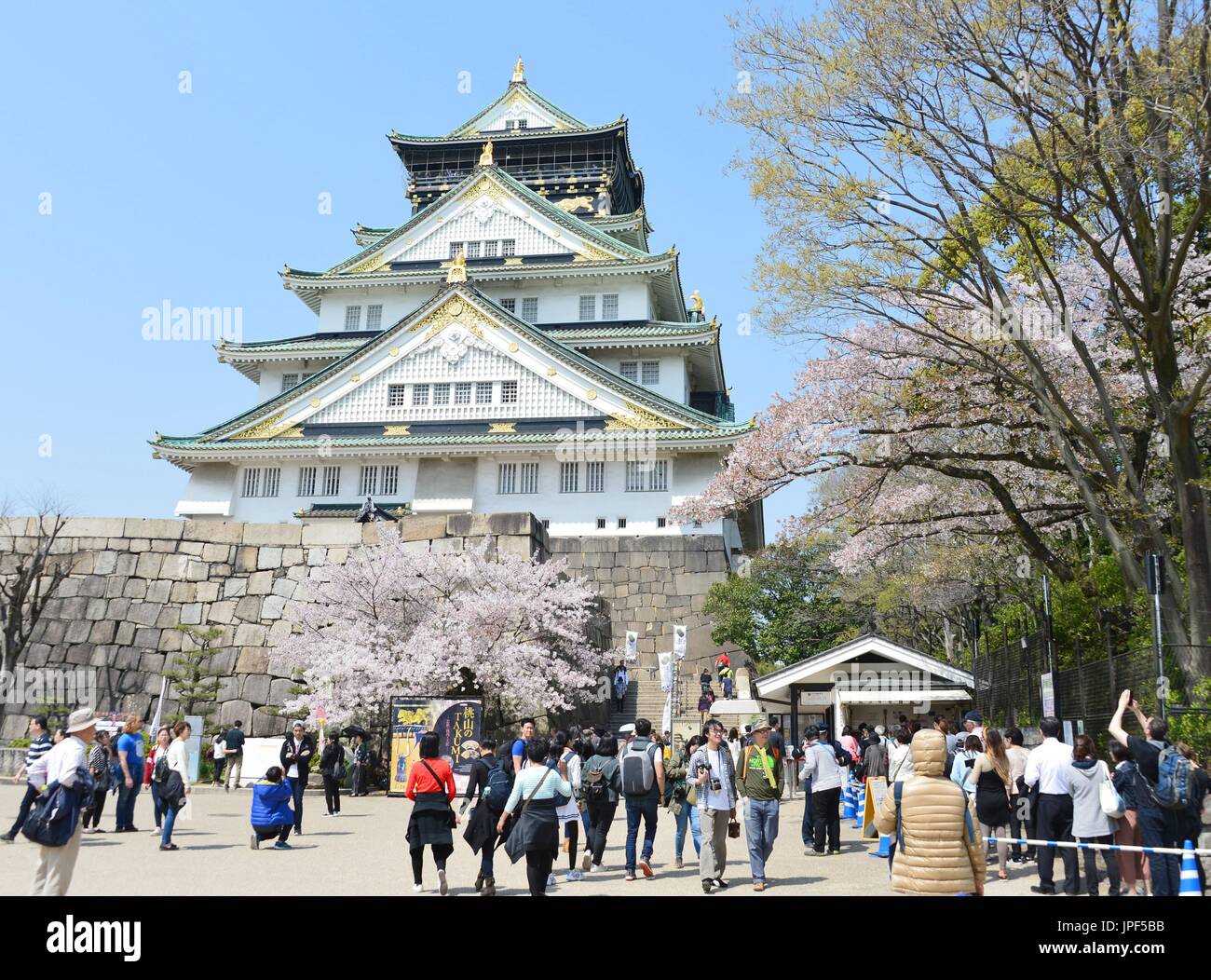 Tourists visit Osaka Castle in the western Japan city on April 14, 2017 ...