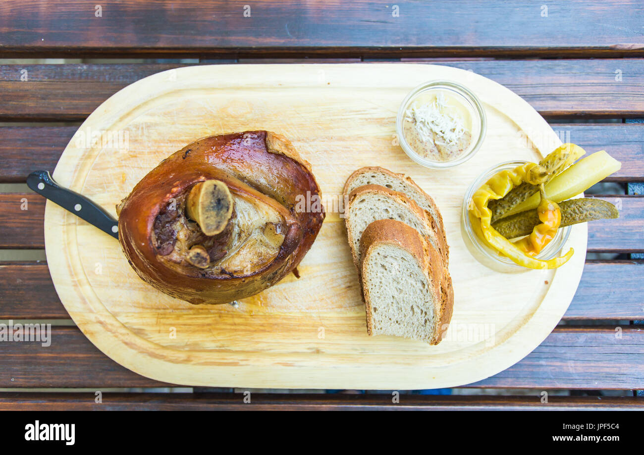 shin, knee wild boar - roast pork leg with vegetables, top view Stock ...