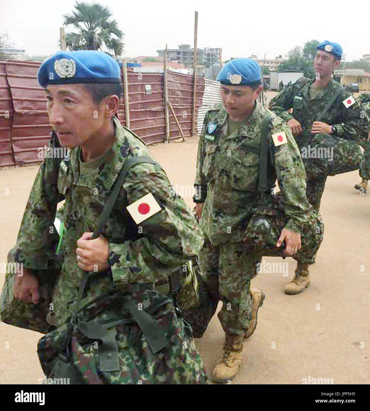 Japanese Ground Self-Defense Force personnel head to an airport in Juba ...