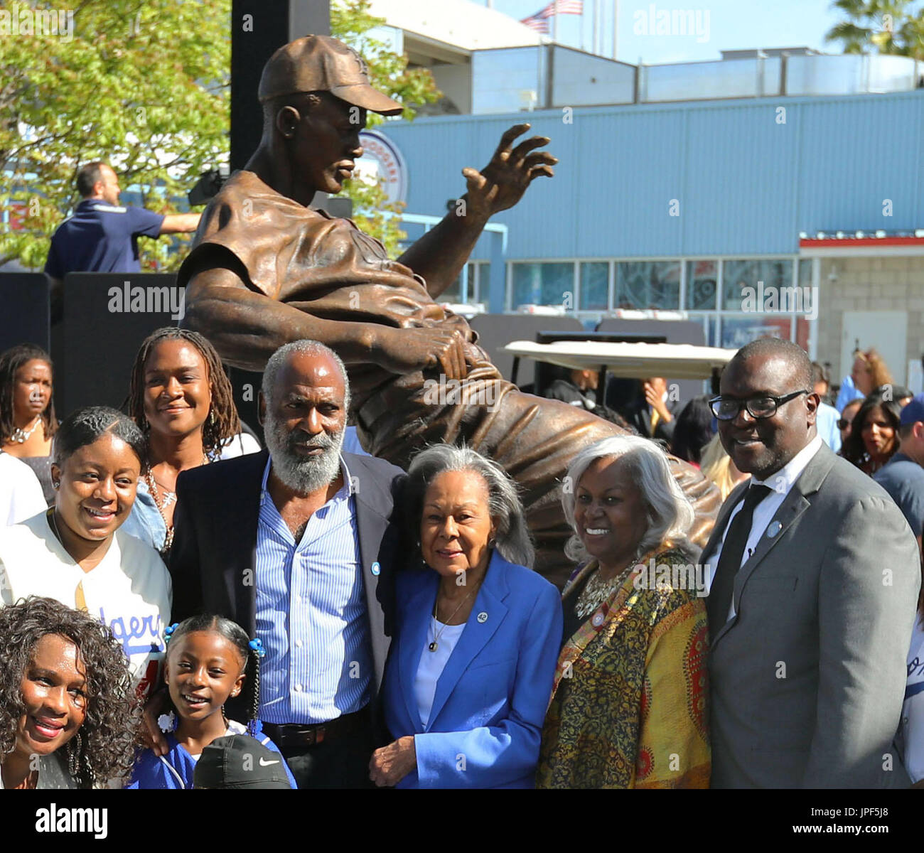 David Robinson (4th from R), a son of Jackie Robinson, poses in front ...